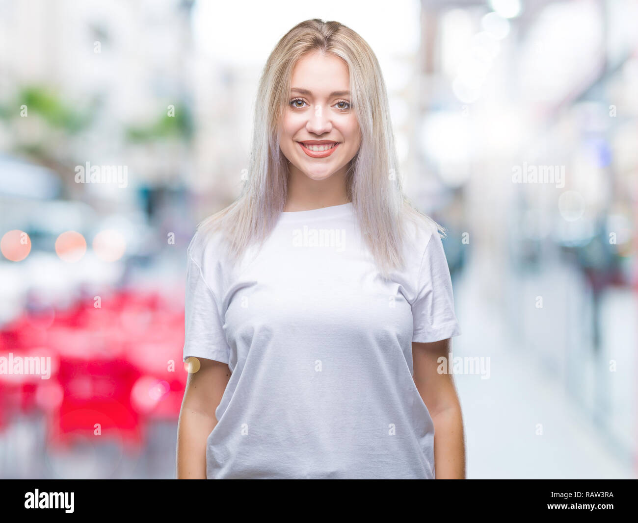 Young blonde woman over isolated background with a happy and cool smile ...