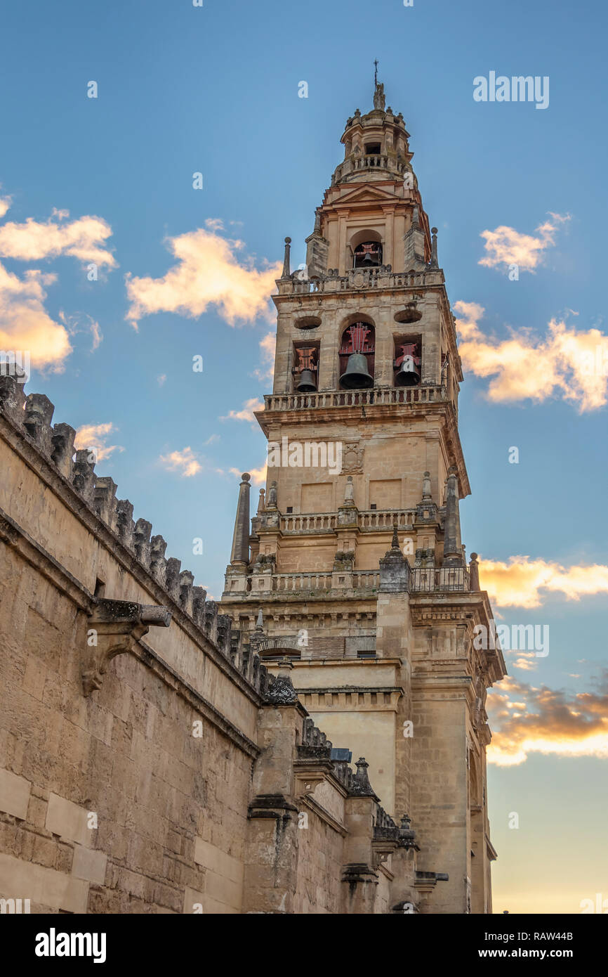 Bell tower of mosque-cathedral of Cordoba at sunset. Original Muslim ...
