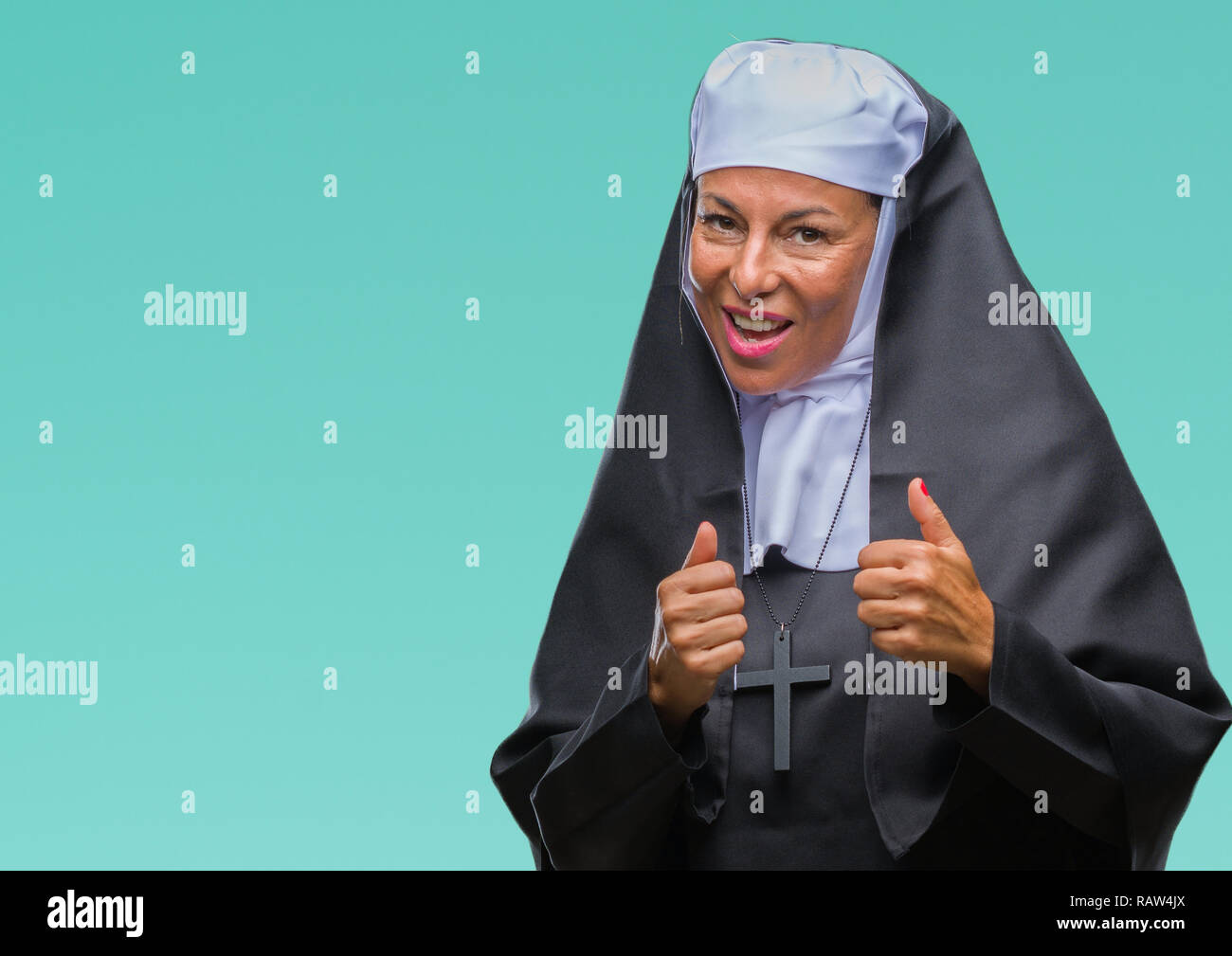 Middle age senior christian catholic nun woman over isolated background ...