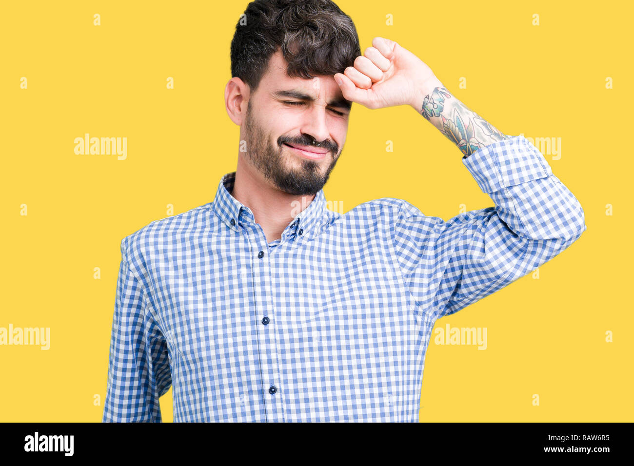 Young handsome business man over isolated background stretching back ...
