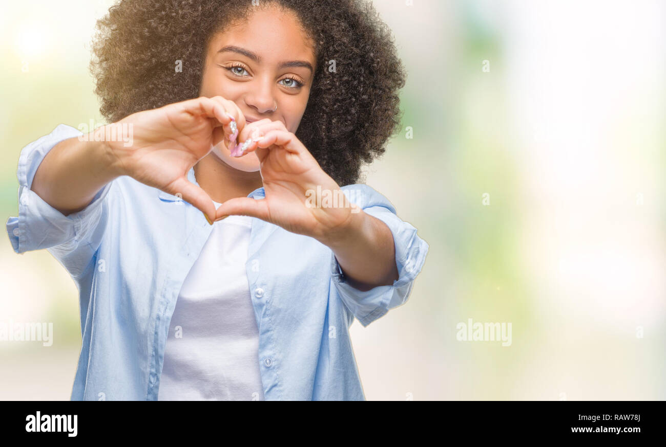 Young afro american woman over isolated background smiling in love ...