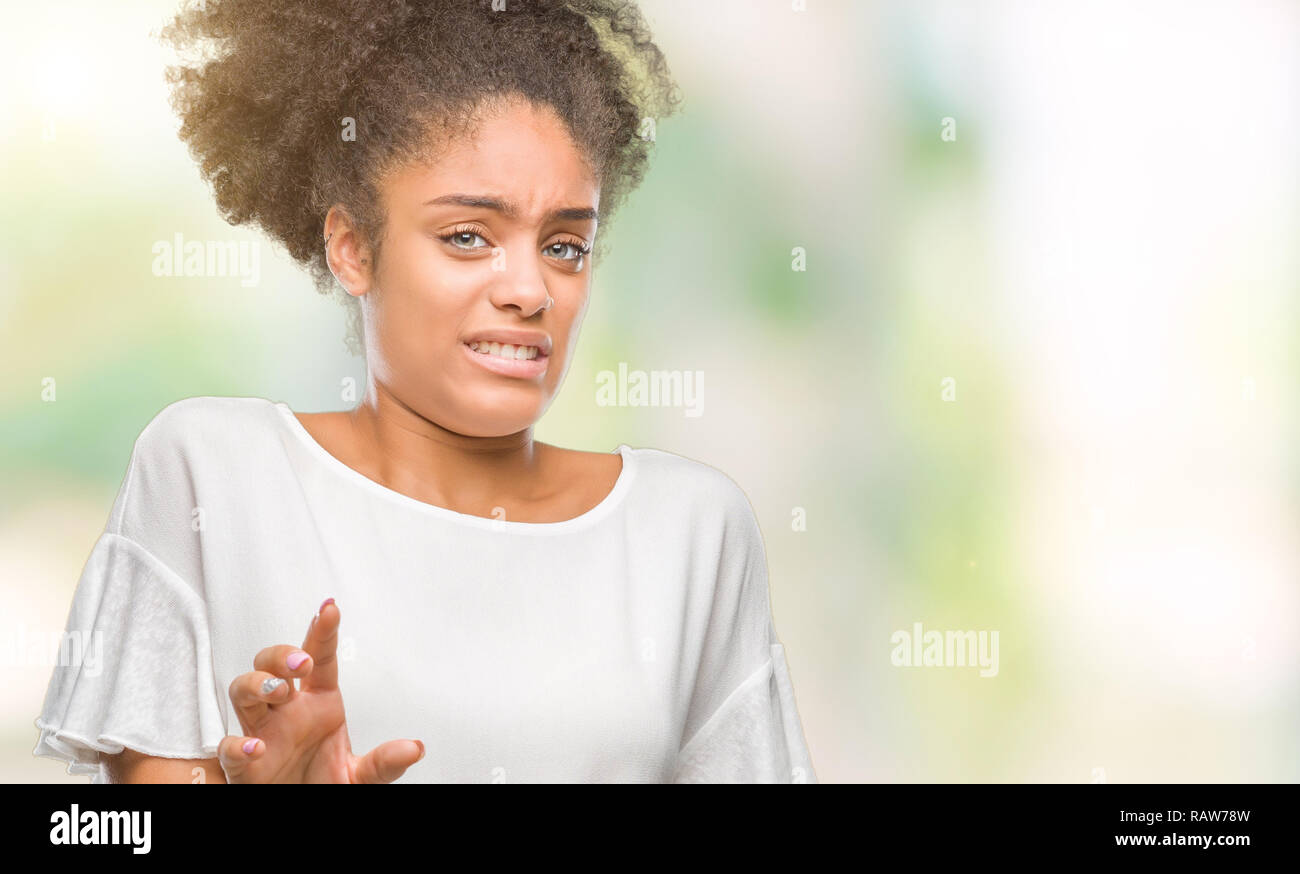 Young afro american woman over isolated background disgusted expression ...