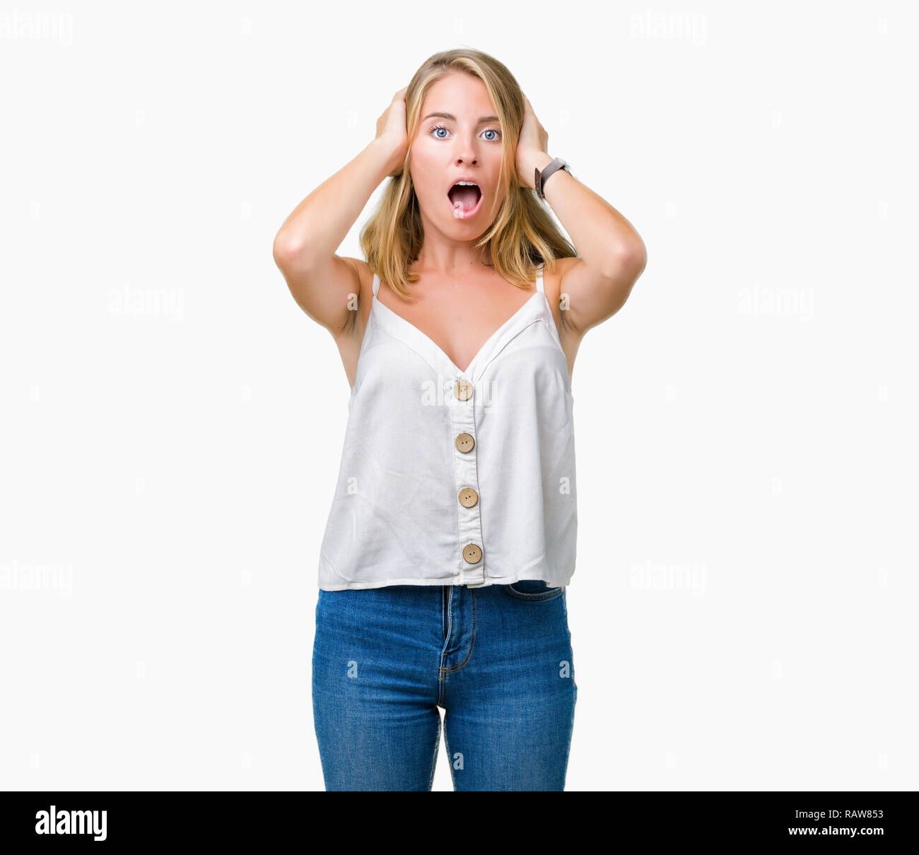 Beautiful young woman over isolated background Crazy and scared with ...