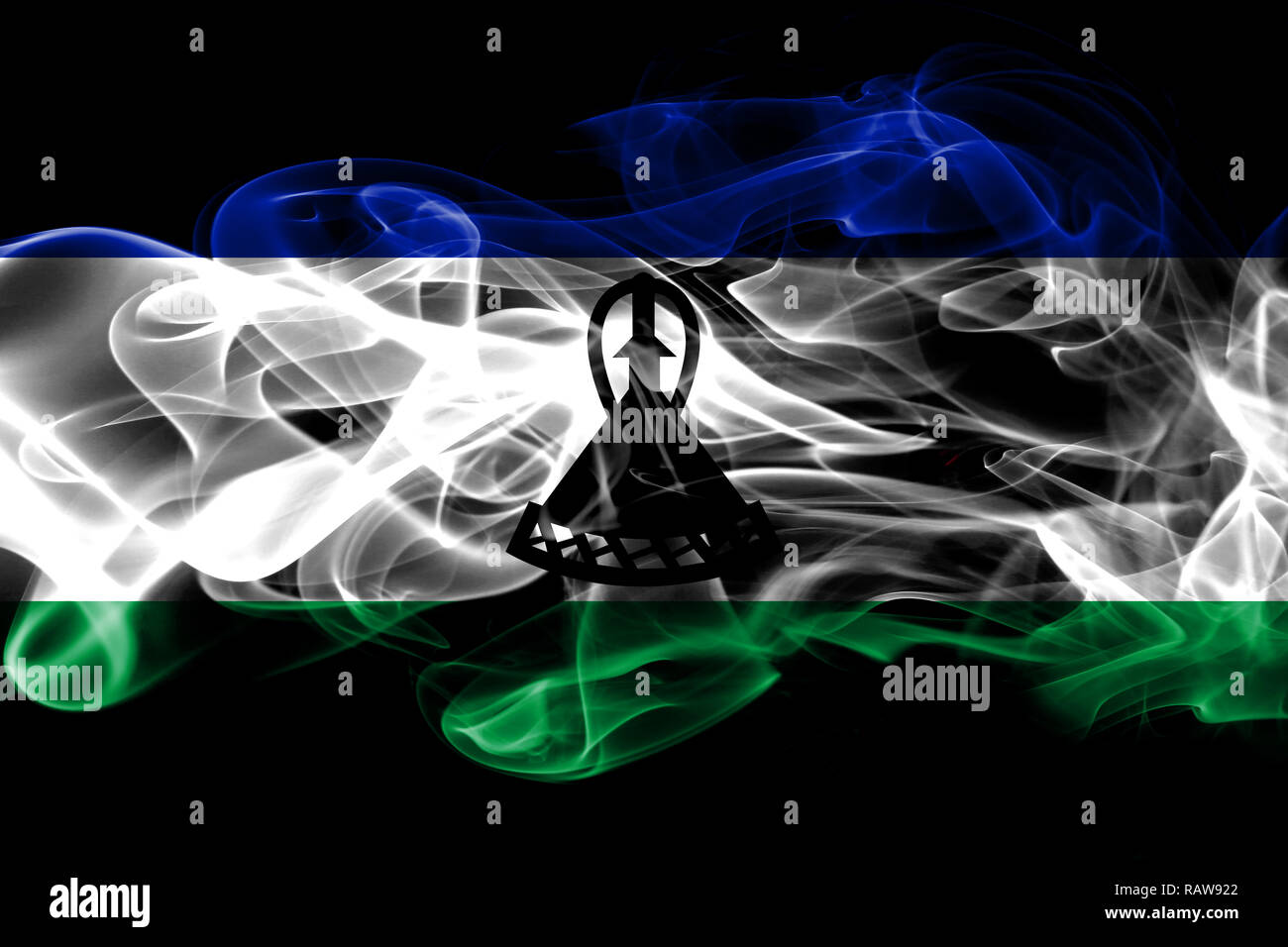 National flag of Lesotho made from colored smoke isolated on black ...