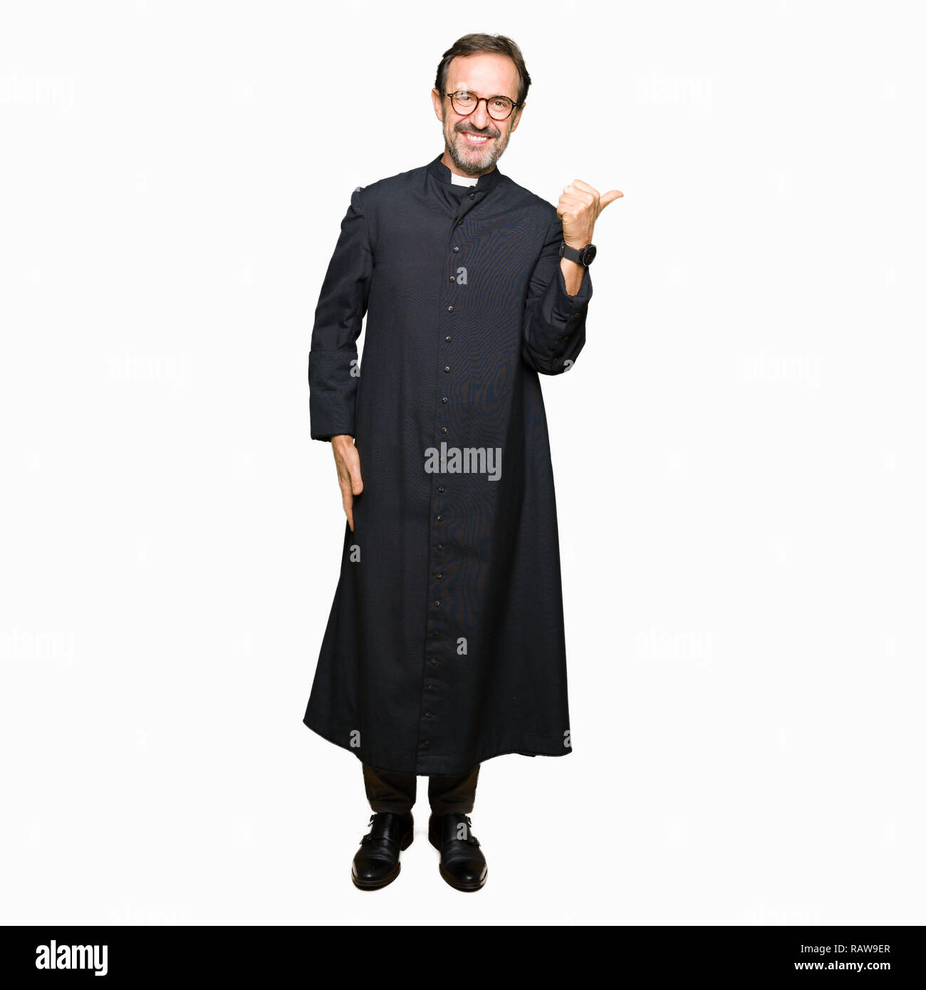 Middle age priest man wearing catholic robe smiling with happy face ...