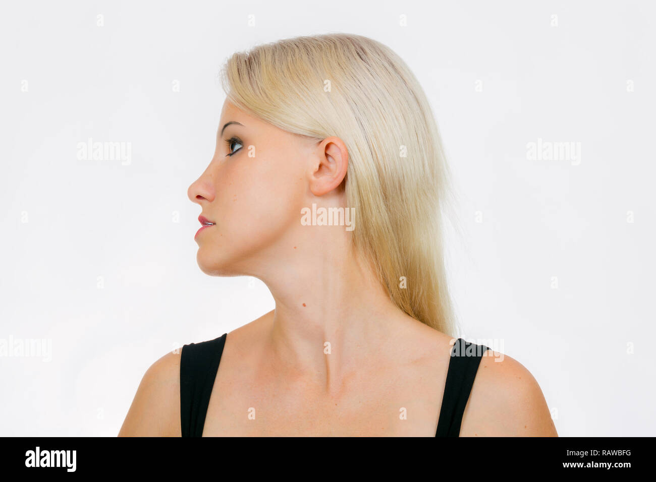 Face exercise, woman turn head to left and shift bottom jaw close-up ...