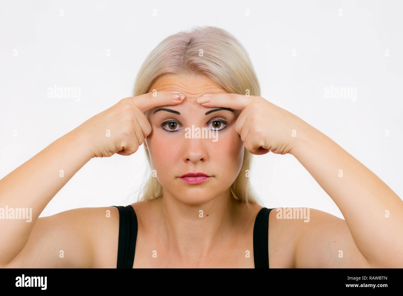 Face exercise brow raiser, woman lift her brows up with fingers Stock ...