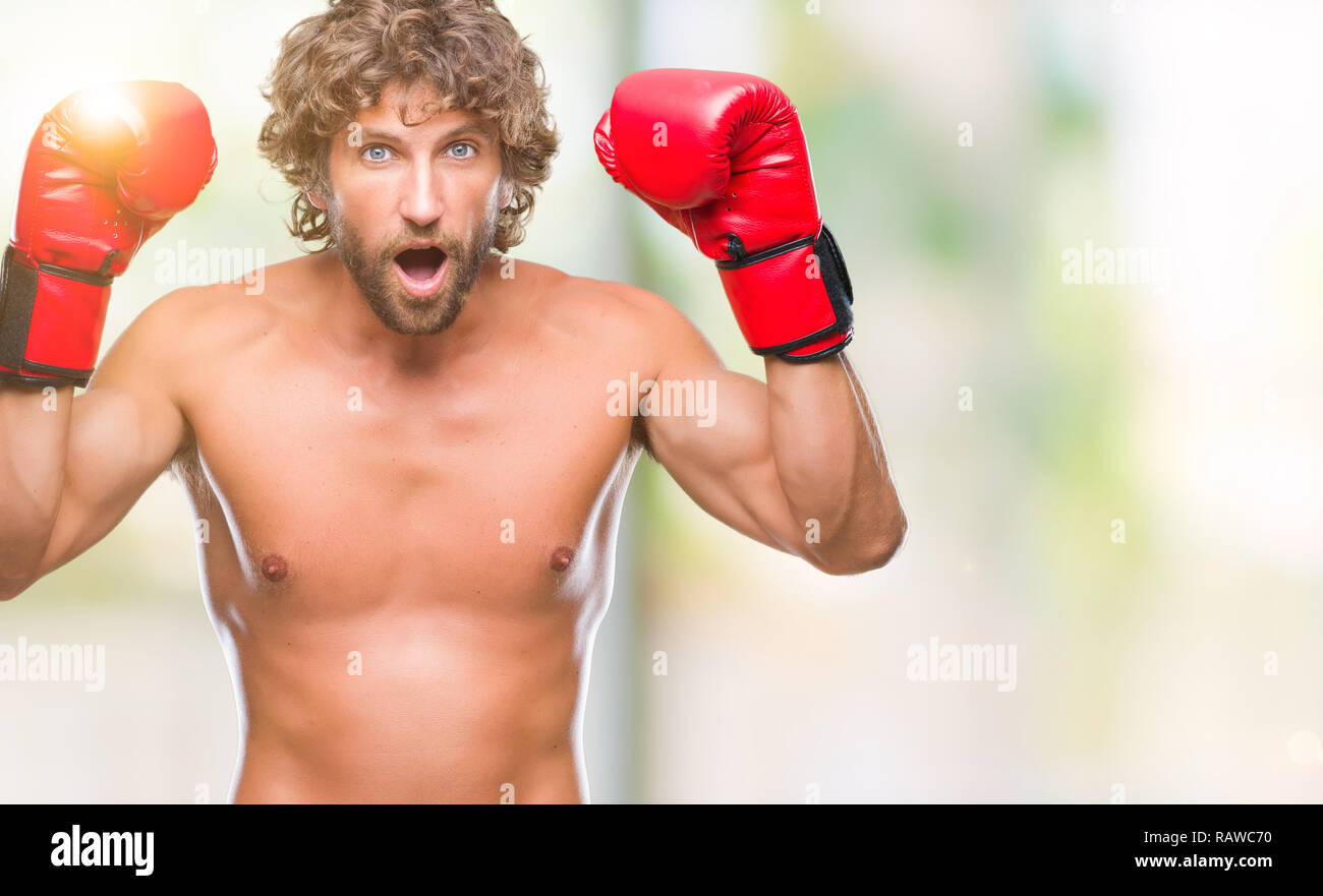Handsome hispanic boxer man wearing boxing gloves over isolated ...