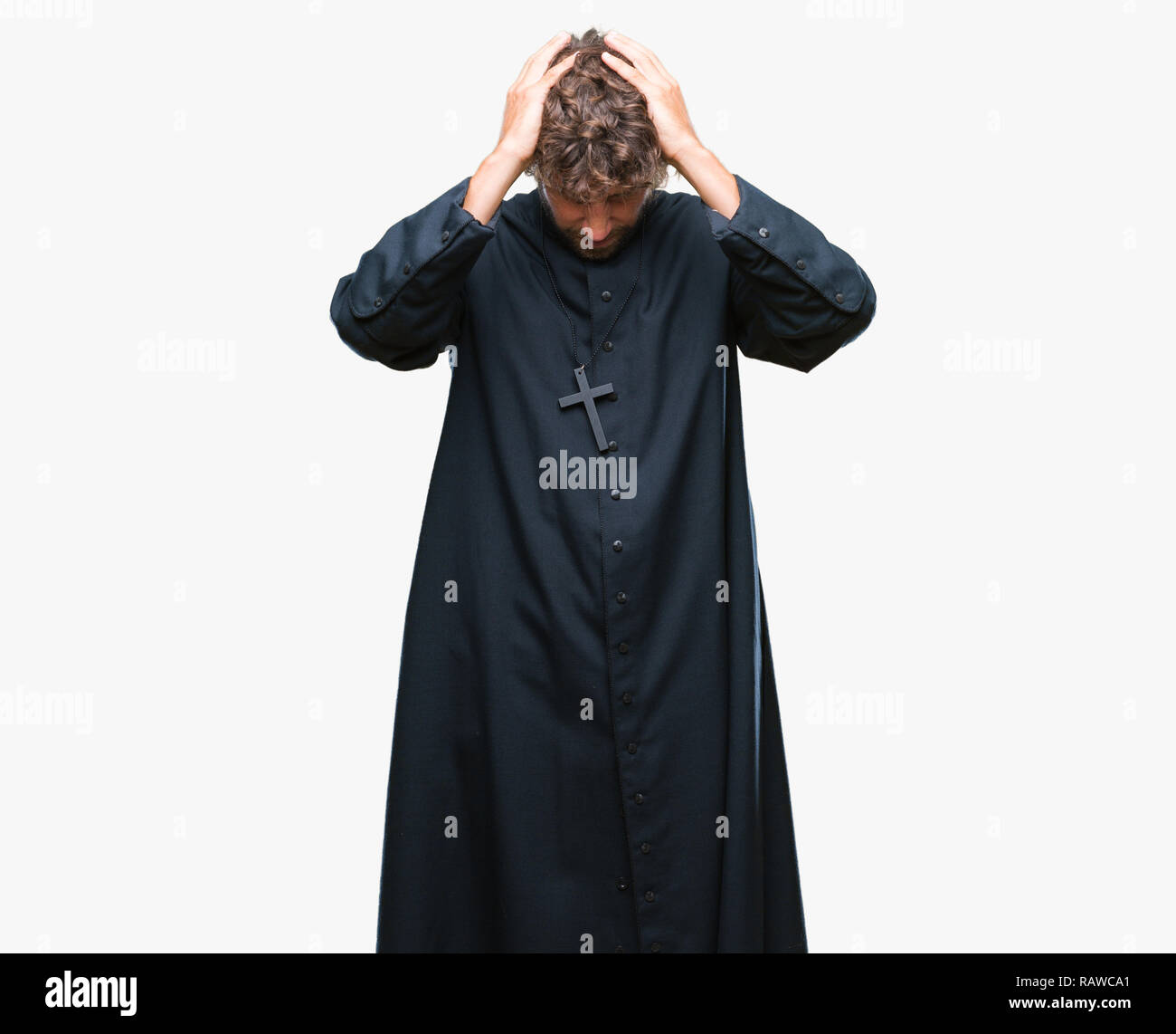 Handsome hispanic catholic priest man over isolated background ...