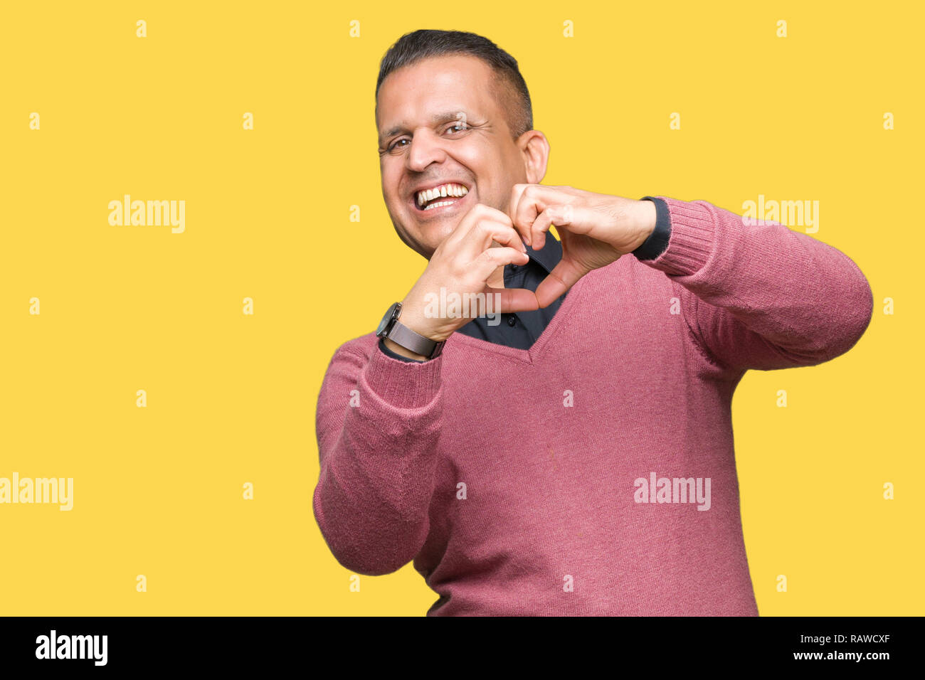 Middle age arab man over isolated background smiling in love showing ...