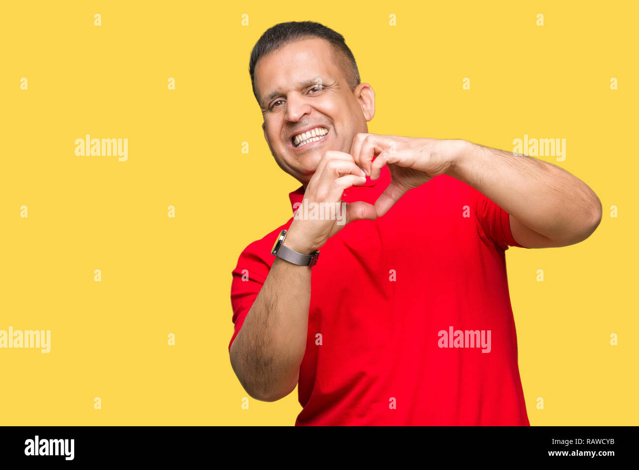 Middle age arab man over isolated background smiling in love showing ...