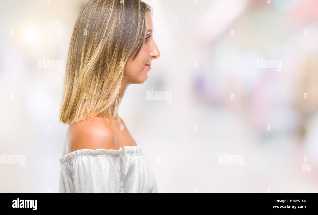 Young beautiful woman over isolated background looking to side, relax ...