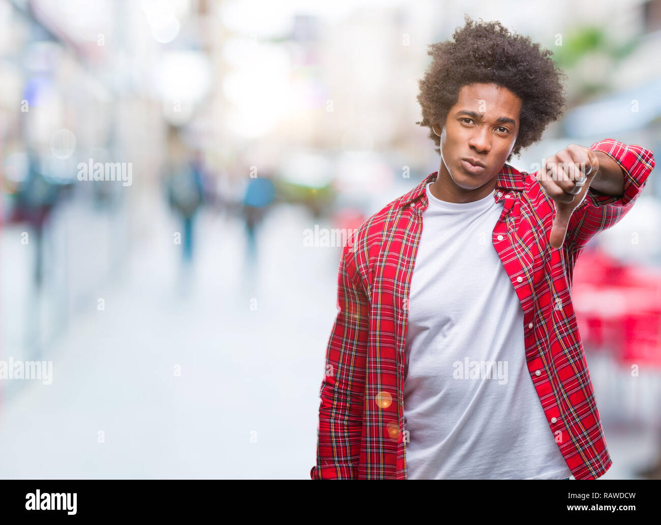 Afro american man over isolated background looking unhappy and angry ...