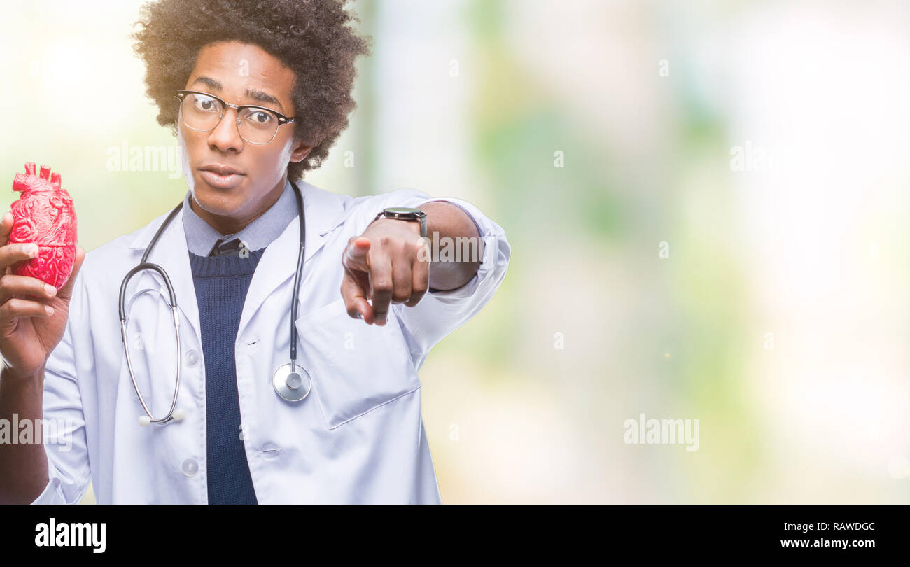 Afro american cardiologist doctor man over isolated background pointing ...