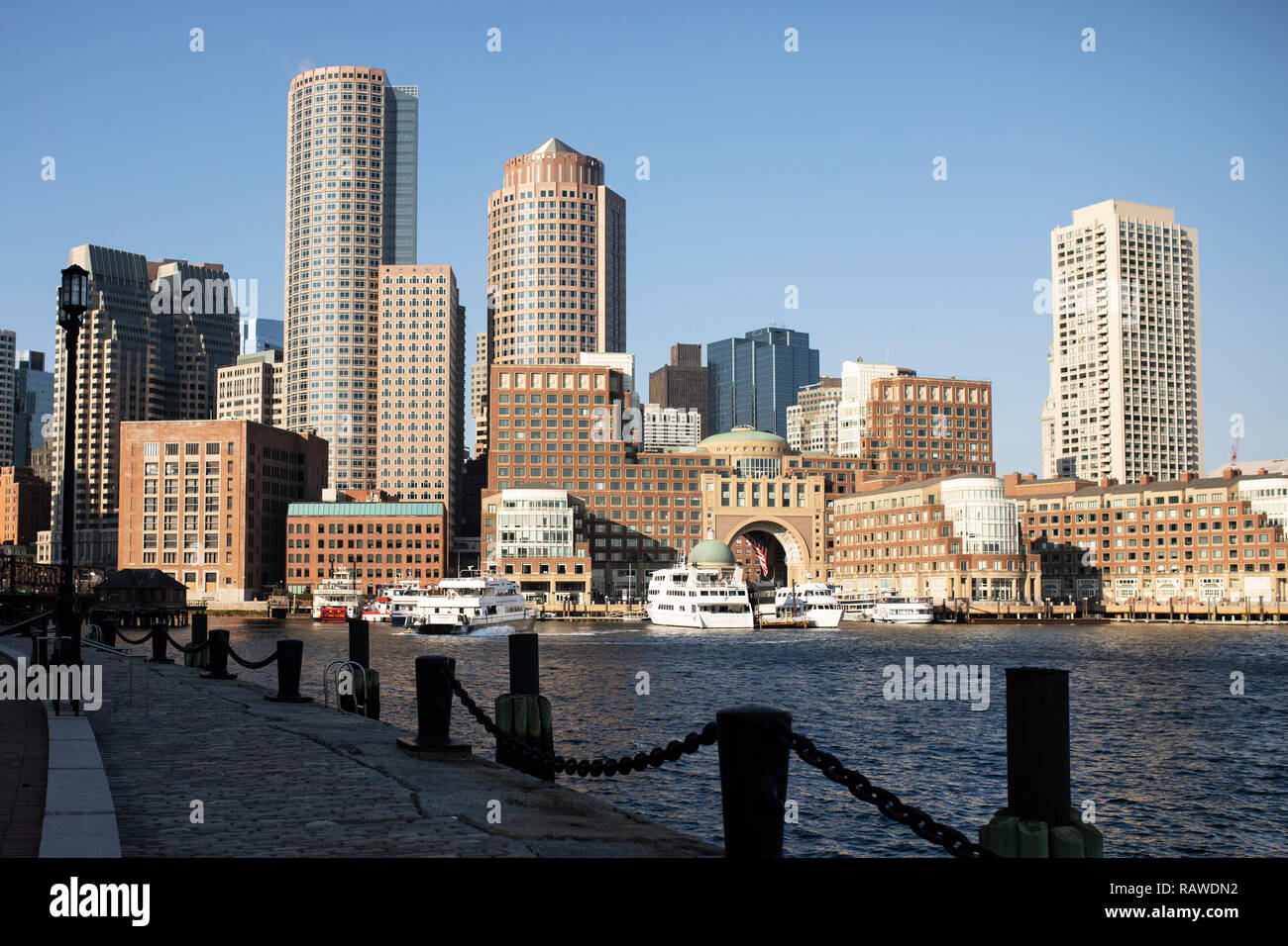 A view across Boston Harbor from Fan Pier Park and the Harborwalk to ...