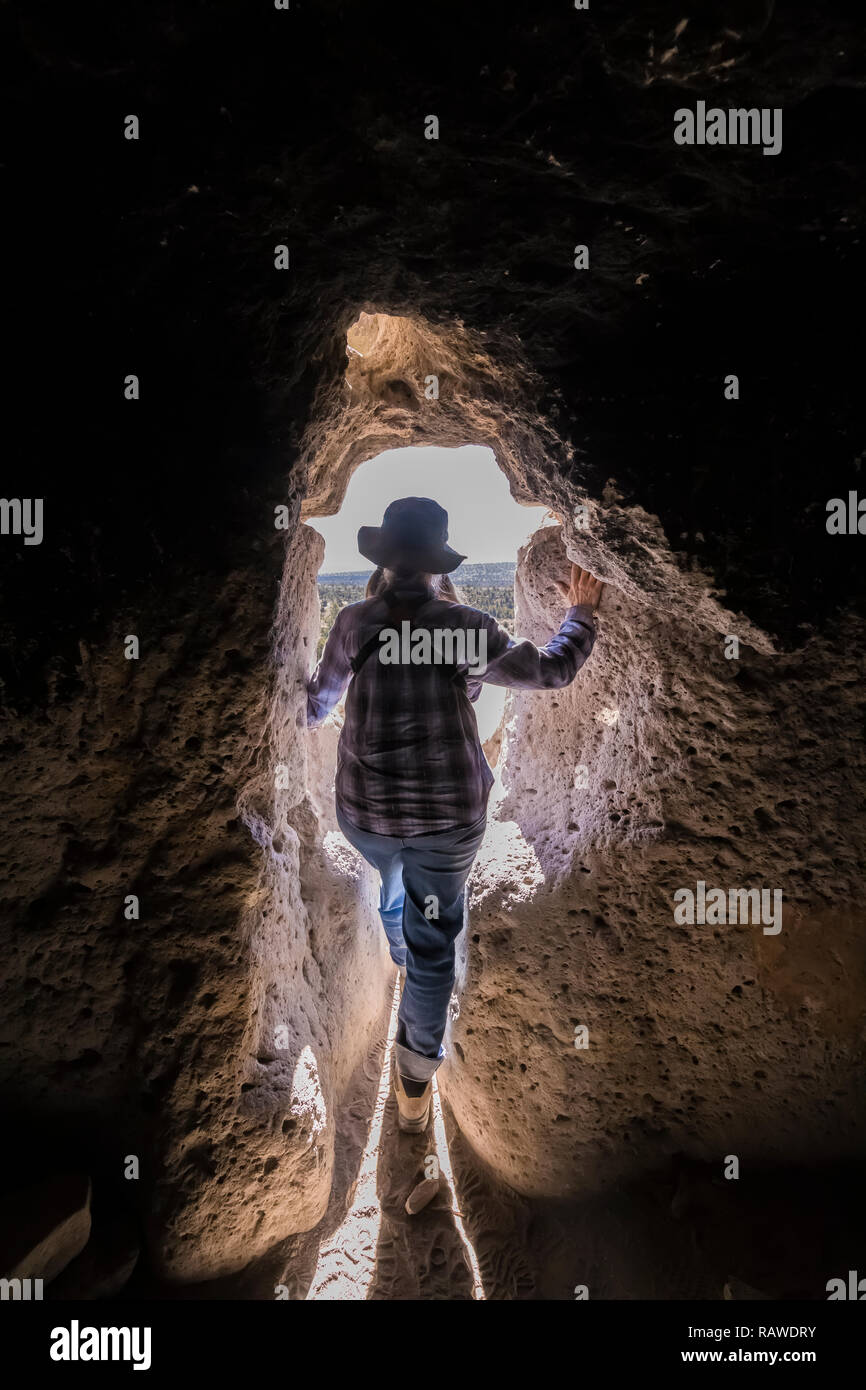 Karen Rentz at entrance to cavate (room) carved from soft tuff rock at ...