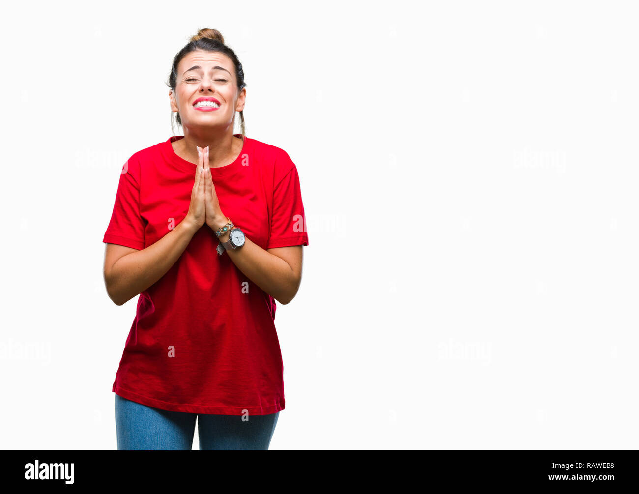 Young beautiful woman over isolated background begging and praying with ...