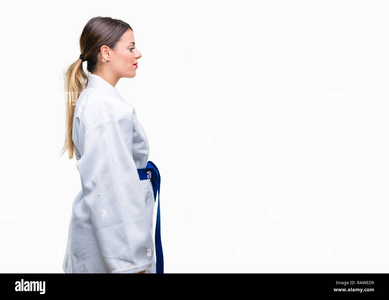 Young Beautiful Woman Wearing Karate Kimono Uniform Over Isolated