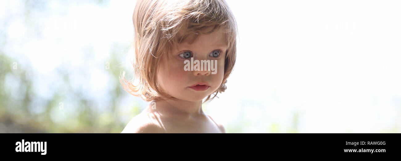 Happy little smiling child on a natural background Stock Photo - Alamy
