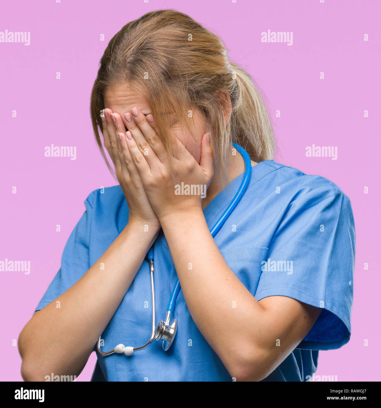 Young caucasian doctor woman wearing surgeon uniform over isolated ...