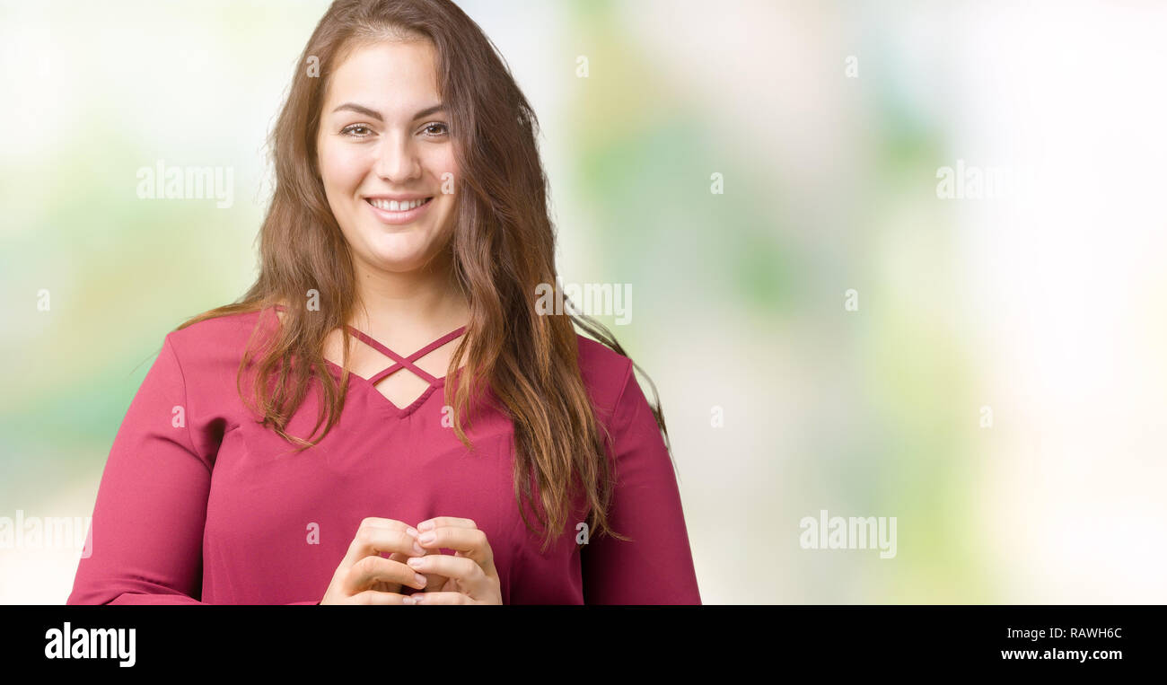Beautiful plus size young woman over isolated background Hands together ...