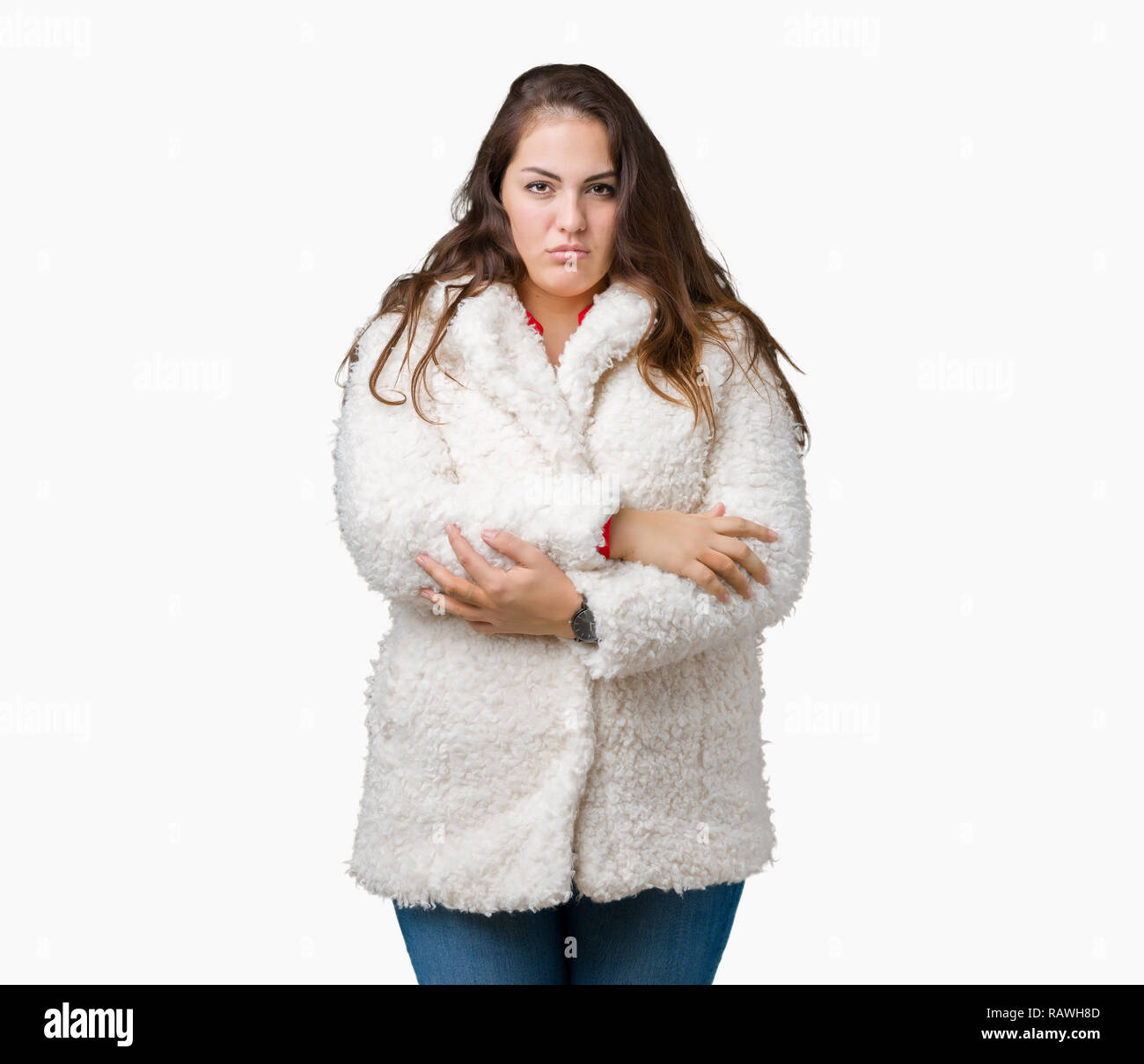 Beautiful plus size young woman wearing winter sheep coat over isolated ...