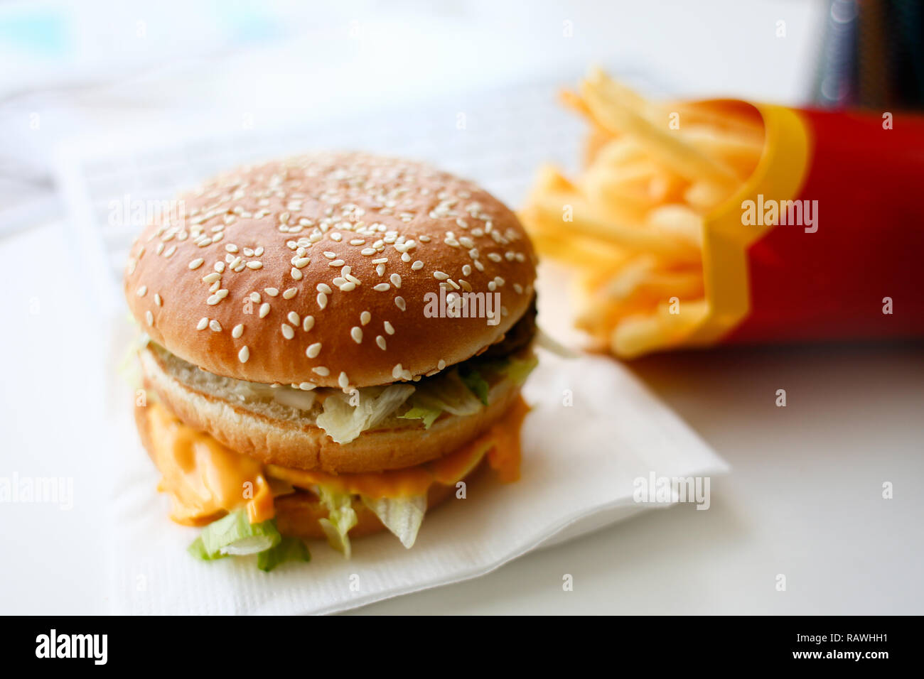 Hamburger and french fries with headphones Stock Photo - Alamy