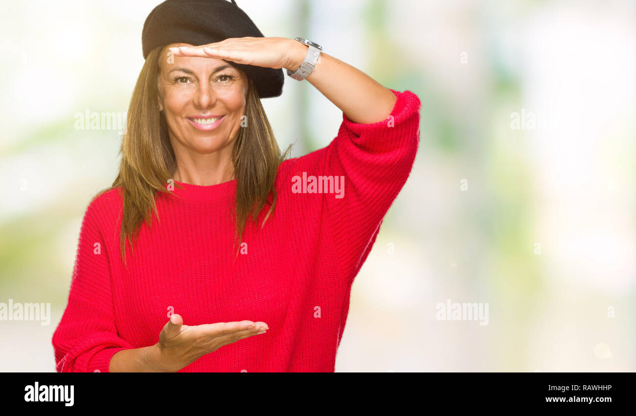 Middle age adult woman wearing fashion beret over isolated background ...
