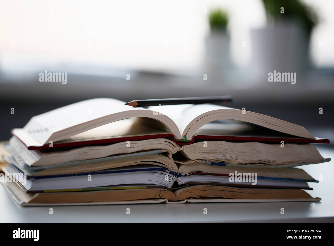 Books lie hi-res stock photography and images - Alamy