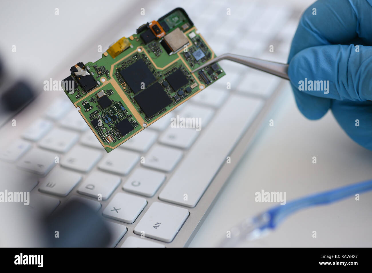 An employee of computer repair service Stock Photo - Alamy