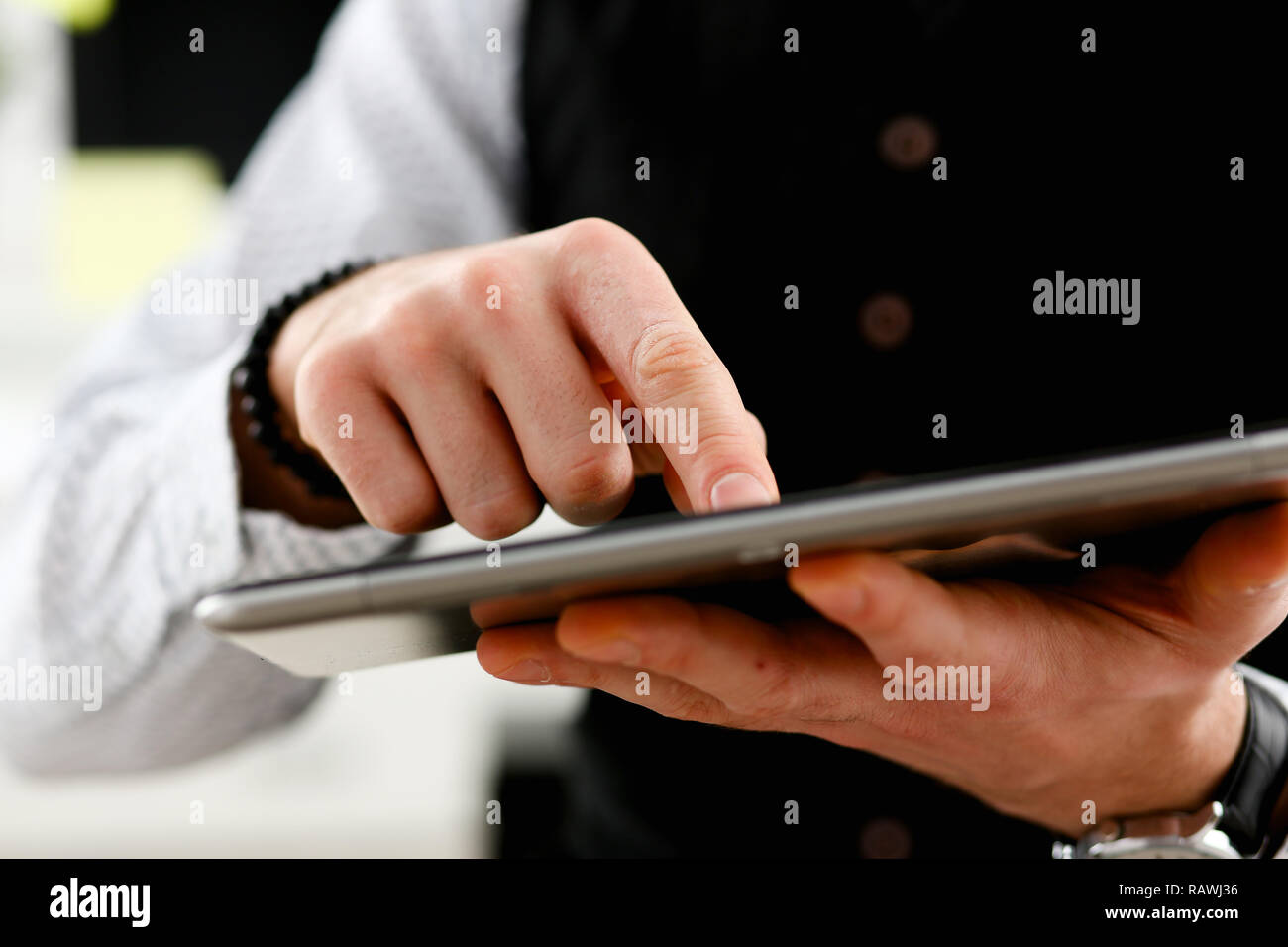 Male arm point finger using tablet pc display Stock Photo - Alamy