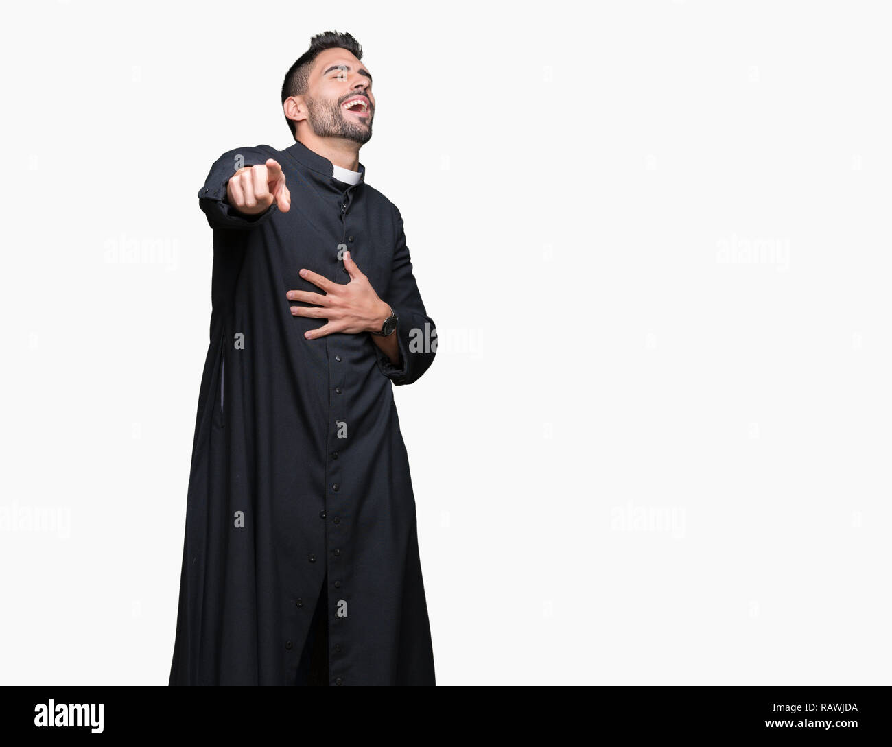 Young Christian priest over isolated background Laughing of you ...