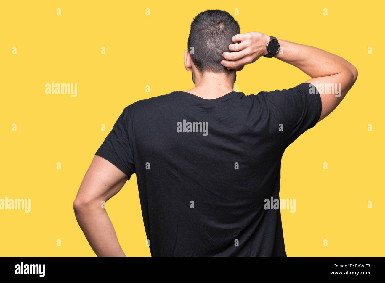 Young handsome man over isolated background Backwards thinking about ...