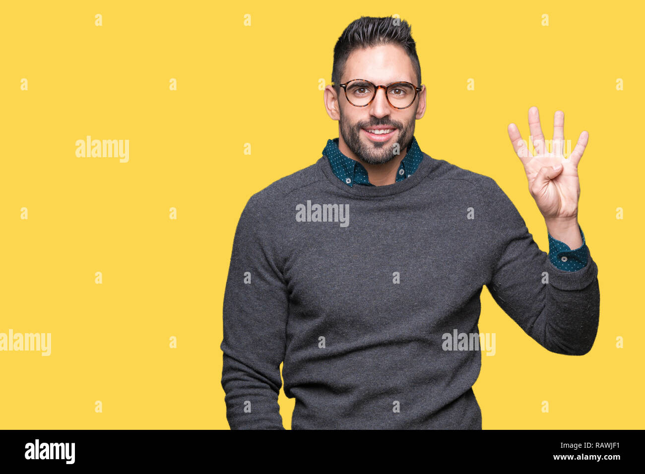 Young handsome man wearing glasses over isolated background showing and ...