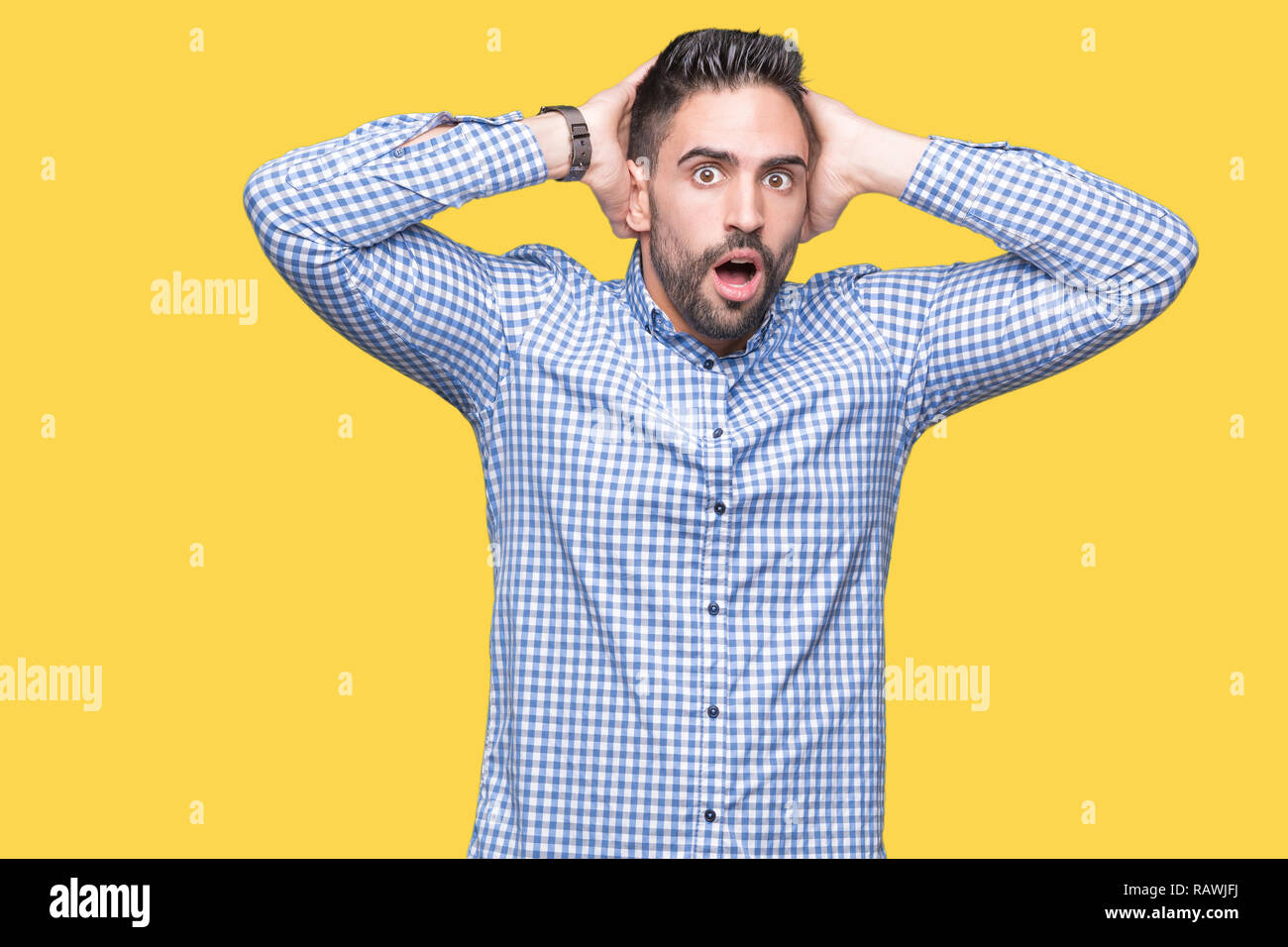 Young handsome man over isolated background Crazy and scared with hands ...