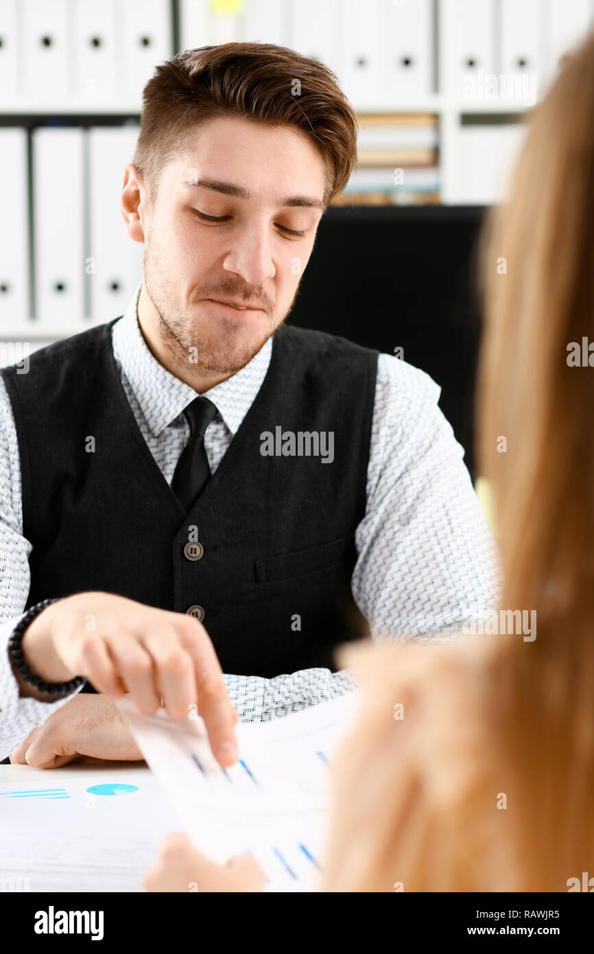 Handsome man in suit offer contract form Stock Photo - Alamy