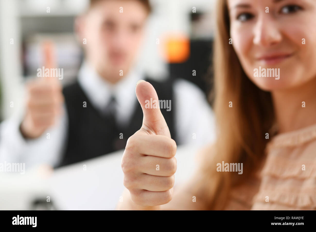 Beautiful smiling woman showing OK Stock Photo - Alamy