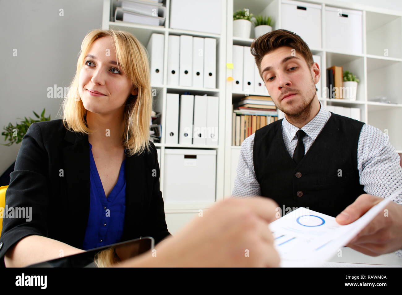 Group of people sit in office deliberate on Stock Photo - Alamy