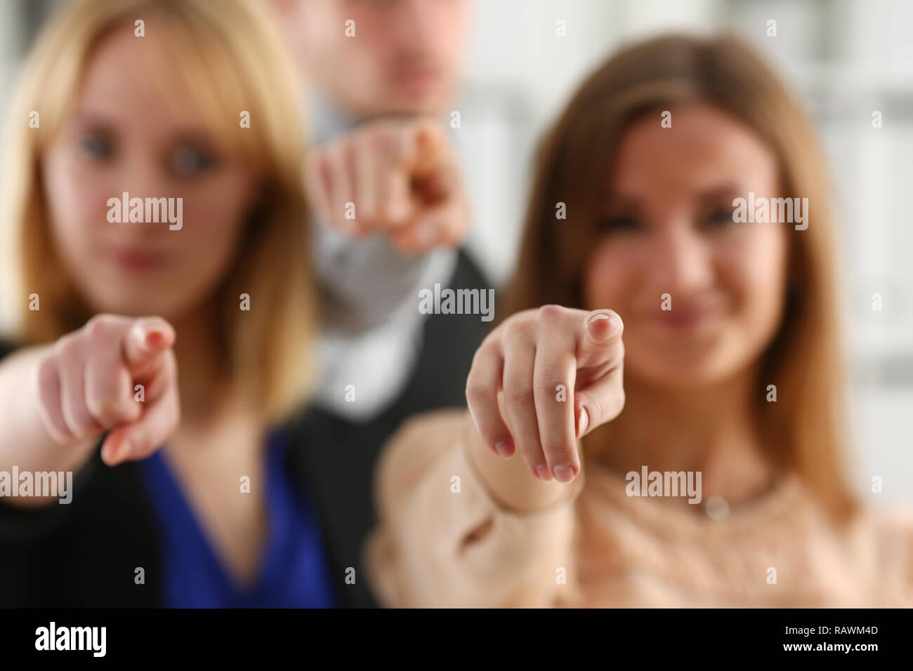 A group of business people pointing their Stock Photo - Alamy