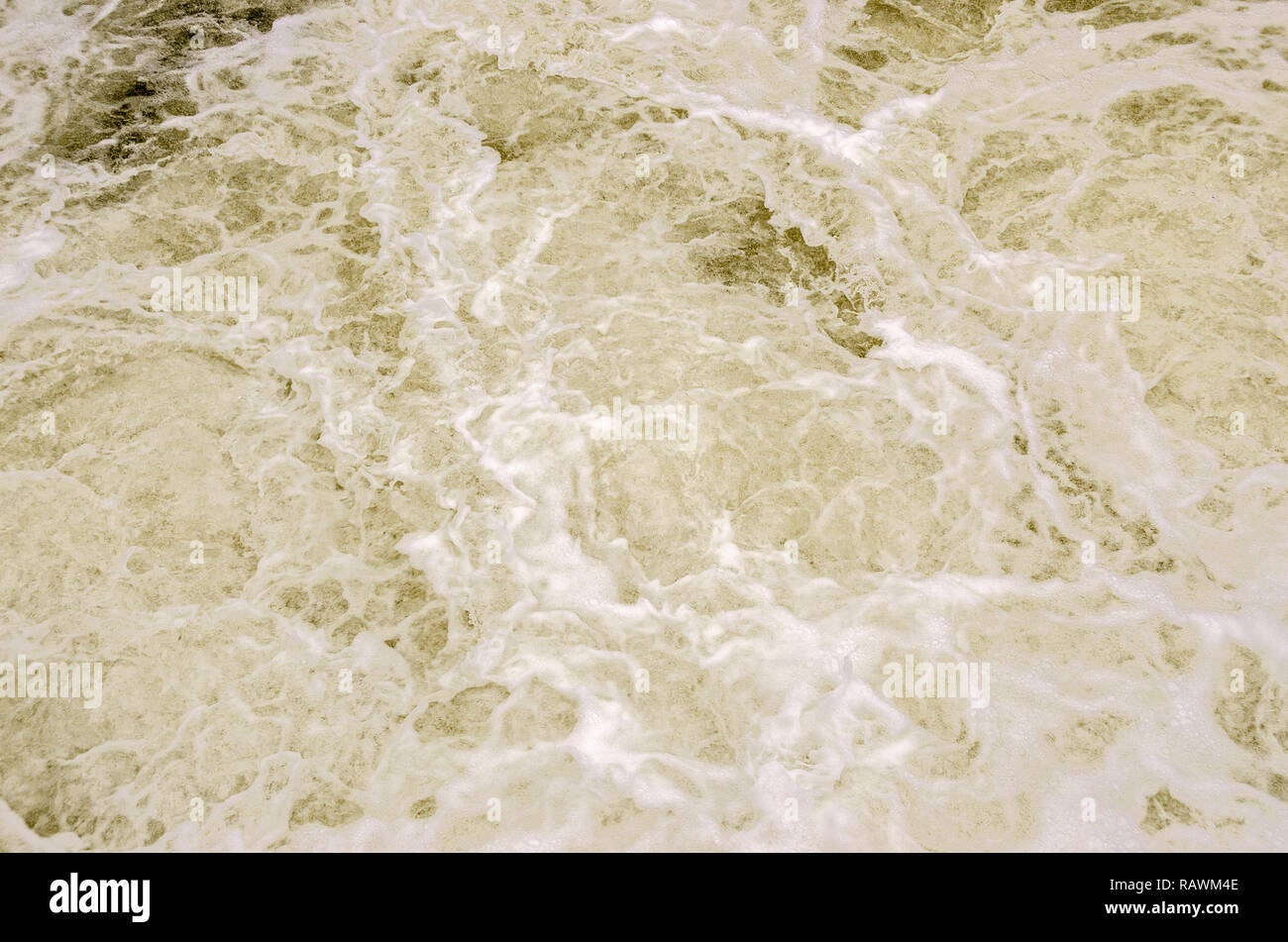 Swirling, fast-moving water at the bottom of a spillway Stock Photo - Alamy