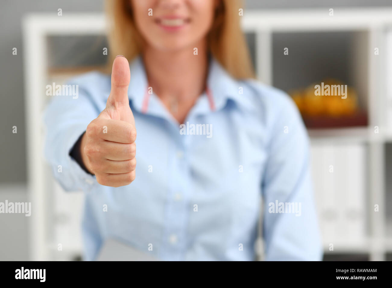 Female arm show OK or approval with thumb up Stock Photo - Alamy
