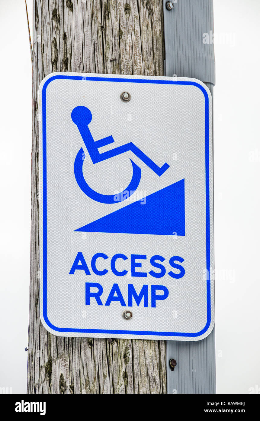 Blue and white sign letting people know there is a wheelchair access ...