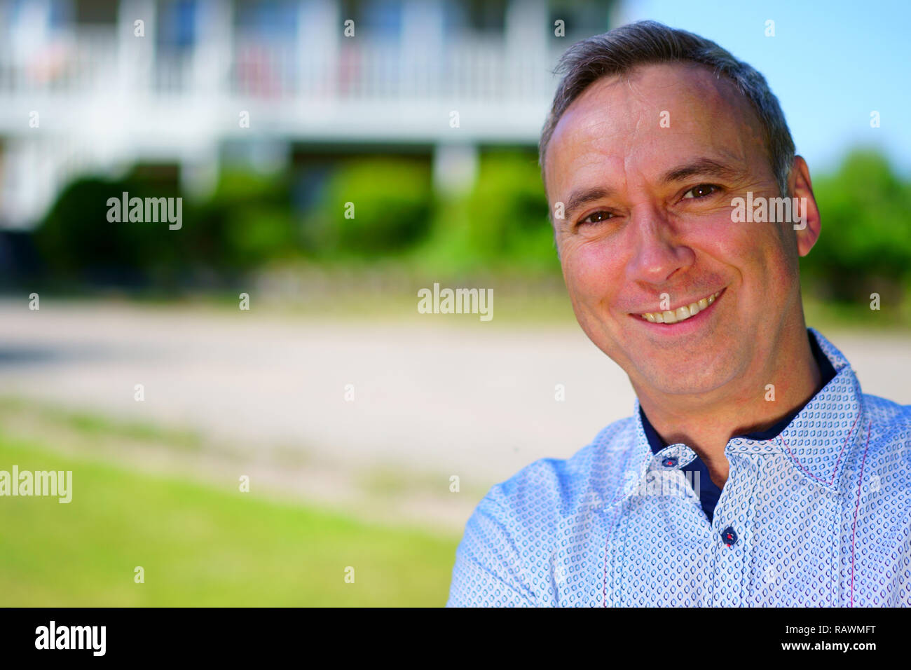 A caucasian man is a proud owner of his house Stock Photo - Alamy