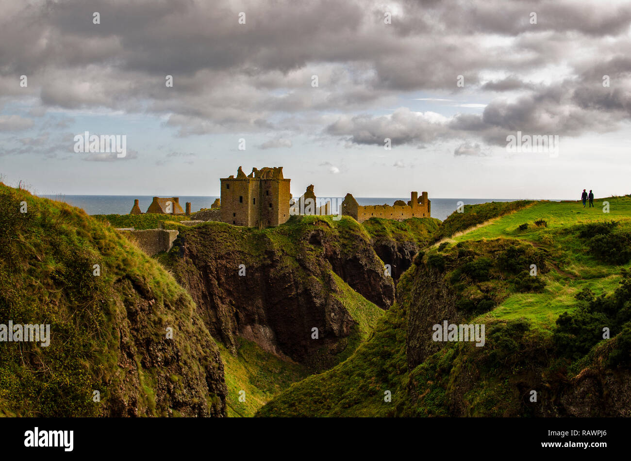 A couple enjoying romantic and dramatic ruins of medieval fortress ...