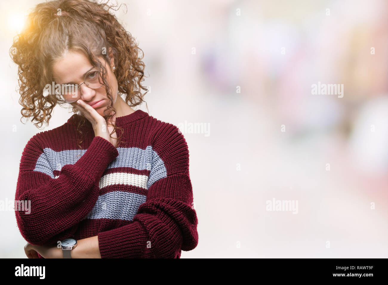 Beautiful brunette curly hair young girl wearing glasses over isolated ...