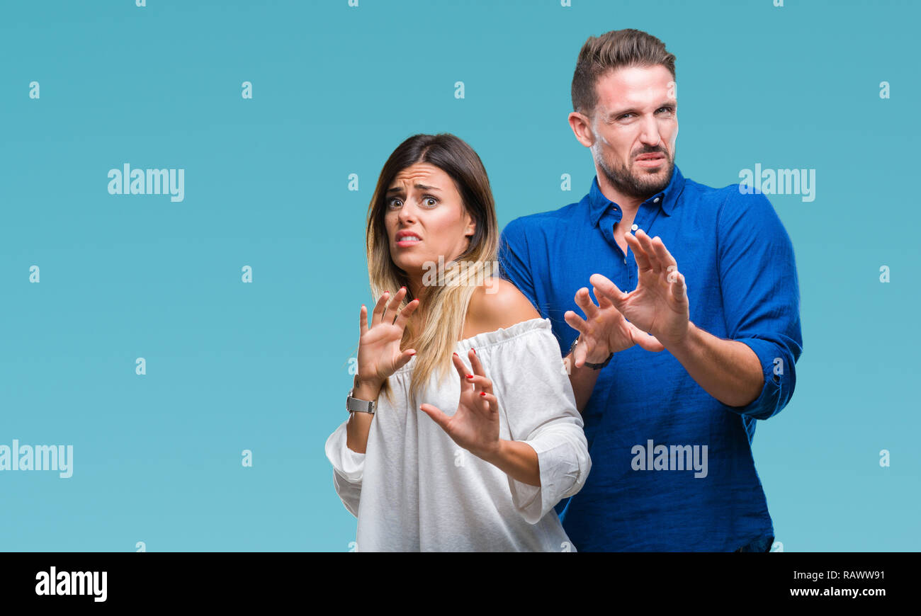 Young couple in love over isolated background disgusted expression ...