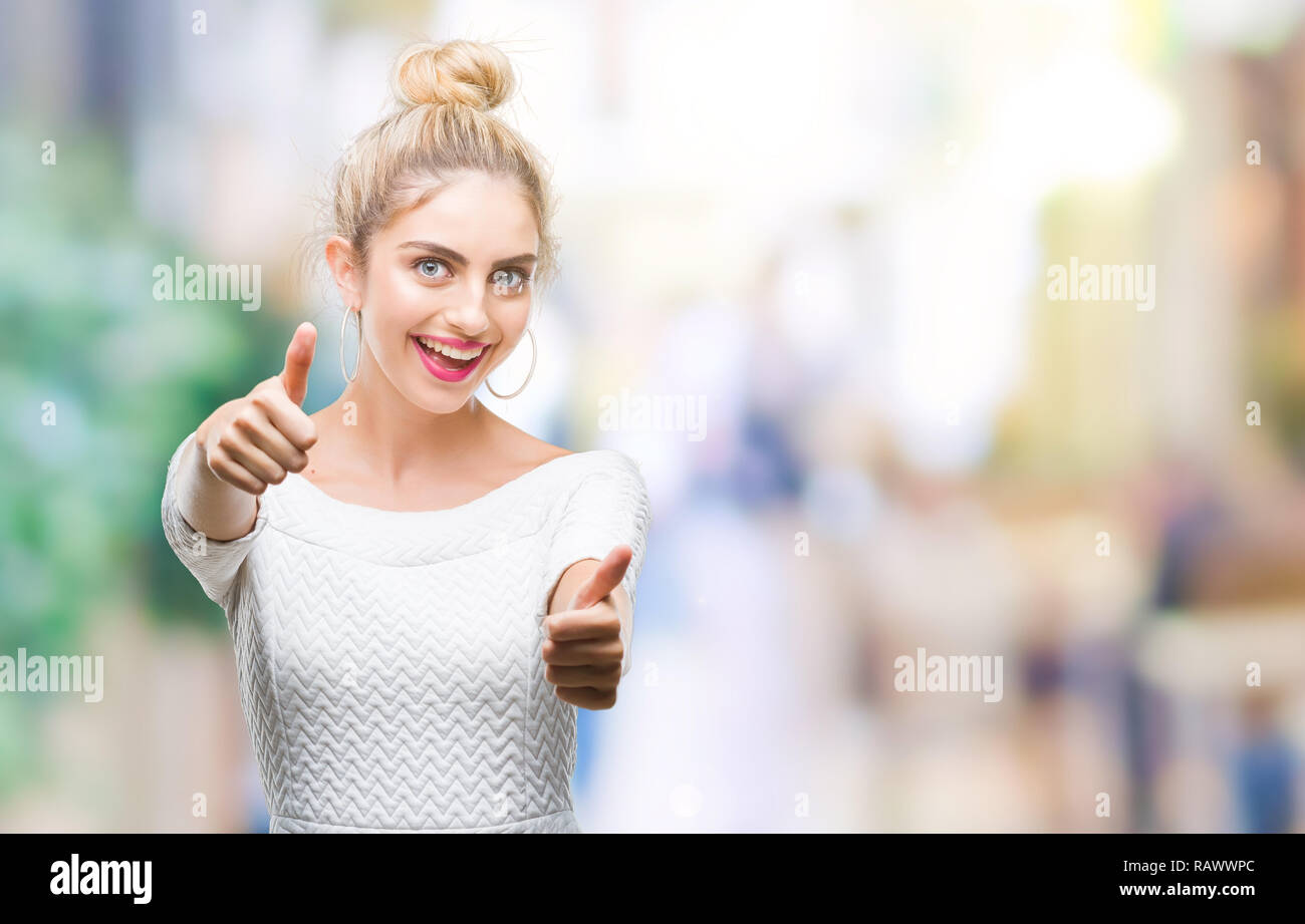 Young beautiful blonde and blue eyes woman over isolated background ...
