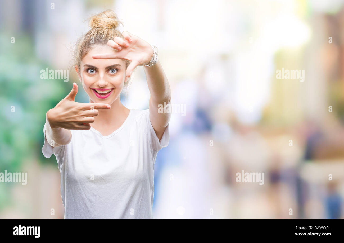 Young beautiful blonde woman wearing white t-shirt over isolated ...