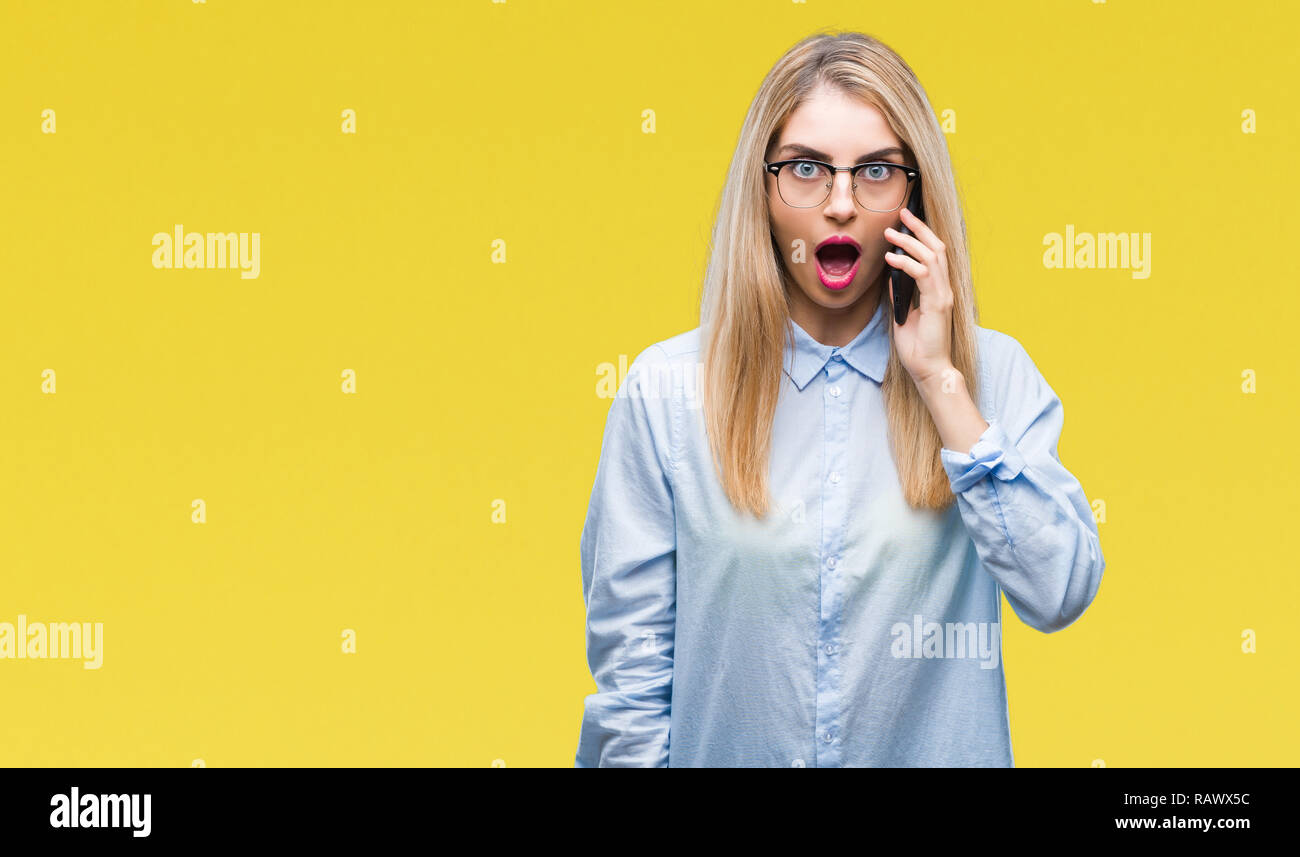 Young beautiful blonde business woman calling on smartphone over ...