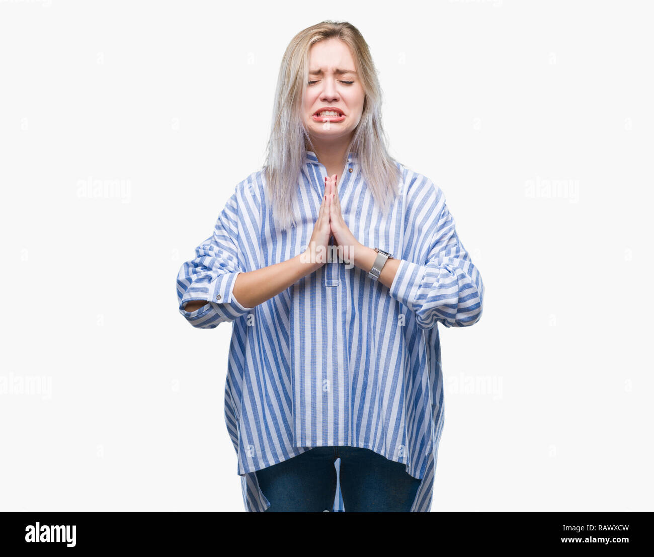 Young blonde woman over isolated background begging and praying with ...